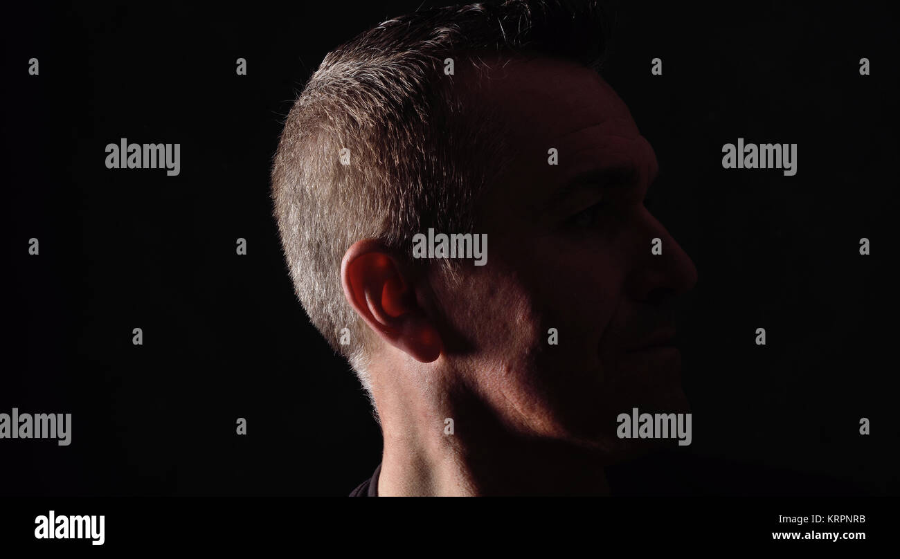 portrait of a man on black background Stock Photo - Alamy
