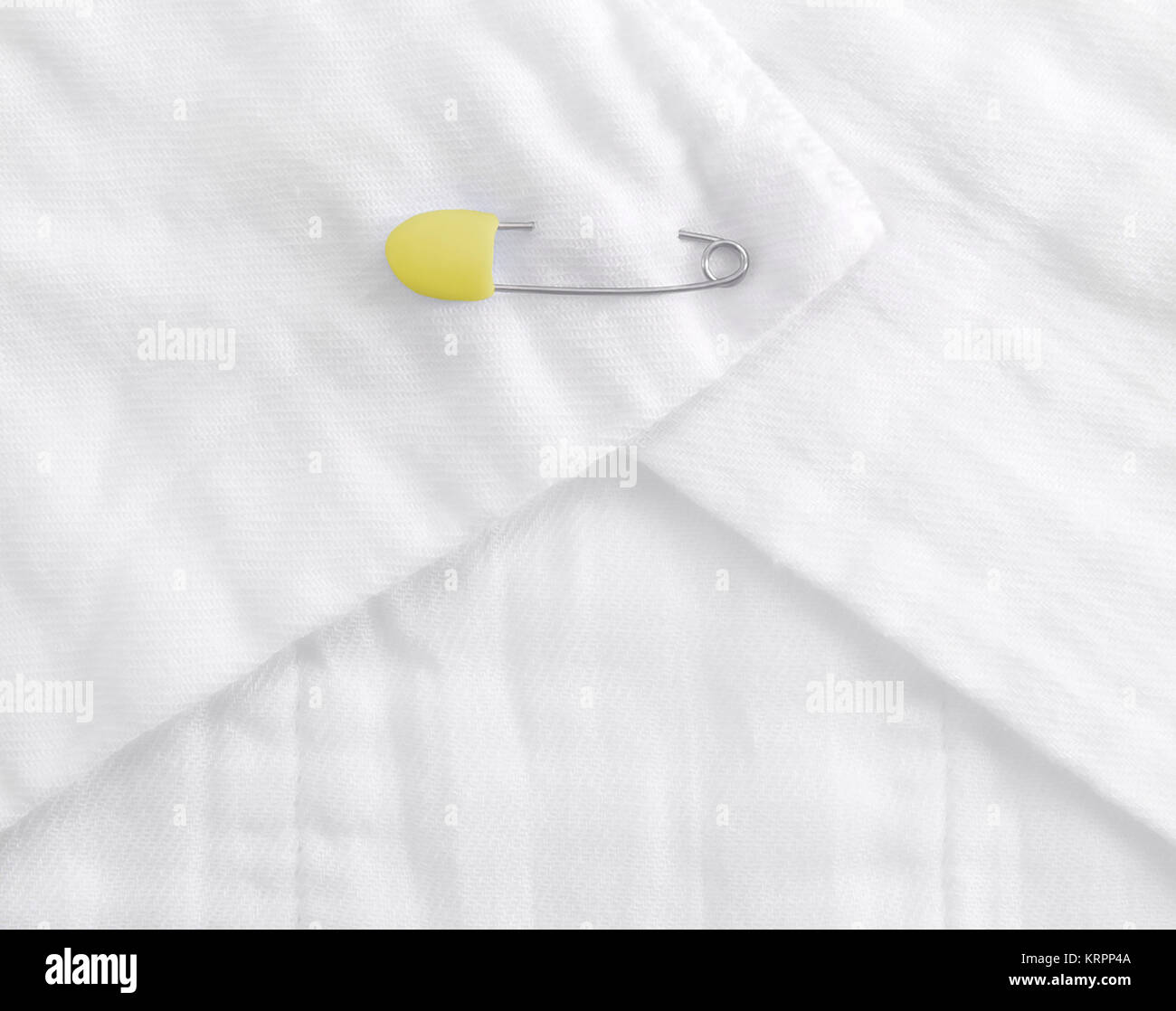 Baby cloth diaper with a yellow safety pin Stock Photo - Alamy