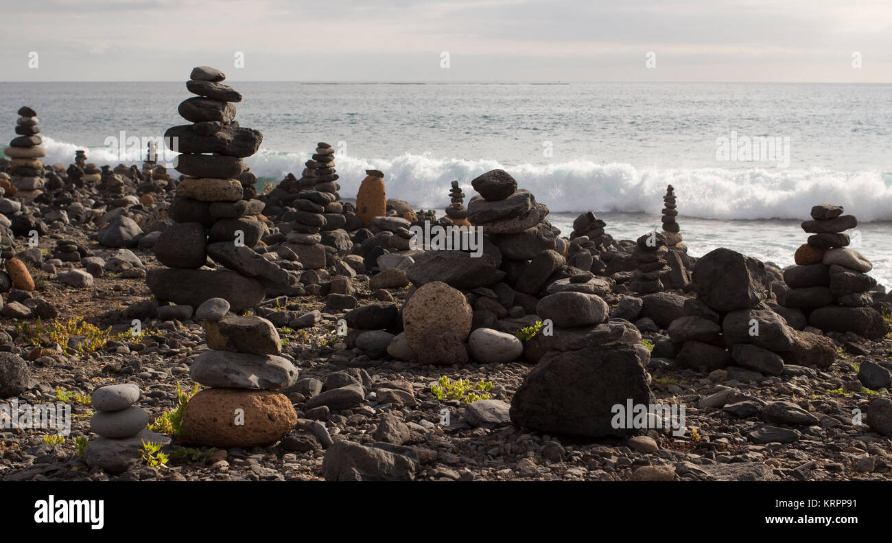 Piles from rocks on the rocky beach Stock Photo - Alamy