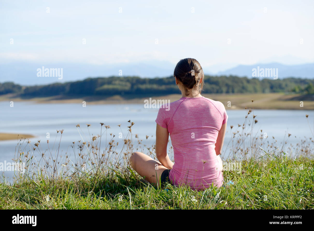 young sporty woman with pink sportswear, back view Stock Photo - Alamy