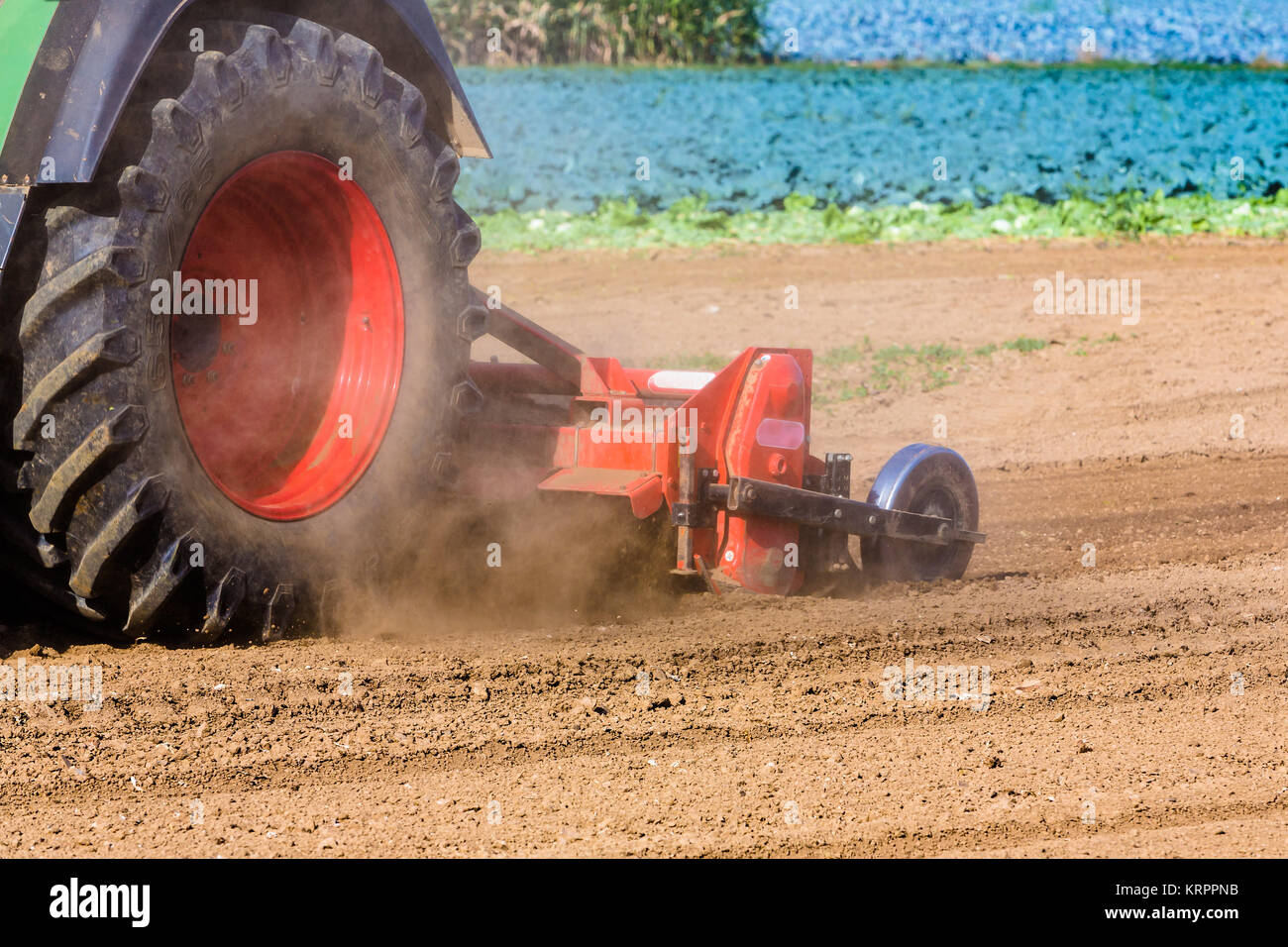 tractor cultivating soil Stock Photo - Alamy