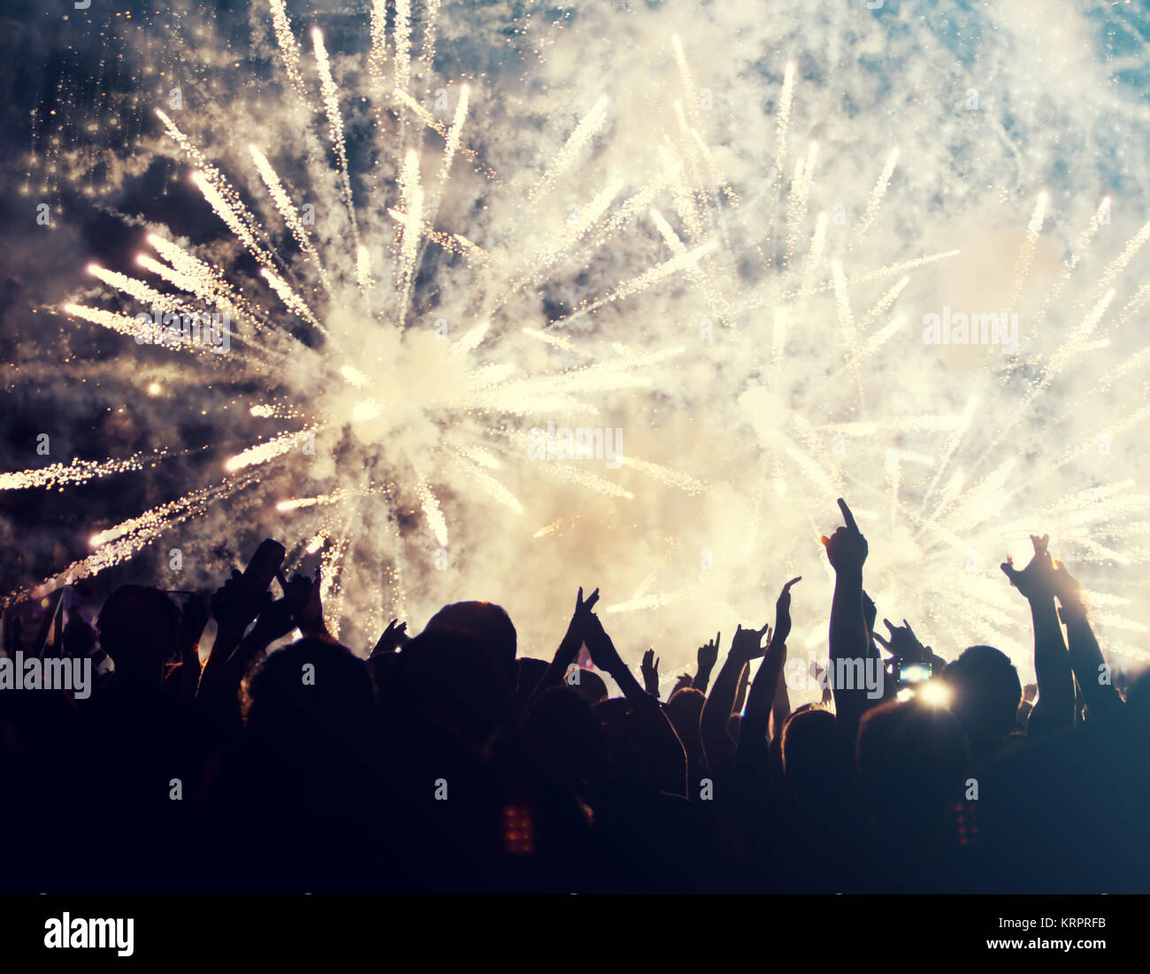 Cheering crowd and fireworks - New Year concept Stock Photo - Alamy