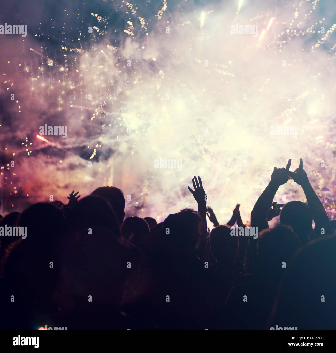 Cheering crowd and fireworks - New Year concept Stock Photo - Alamy