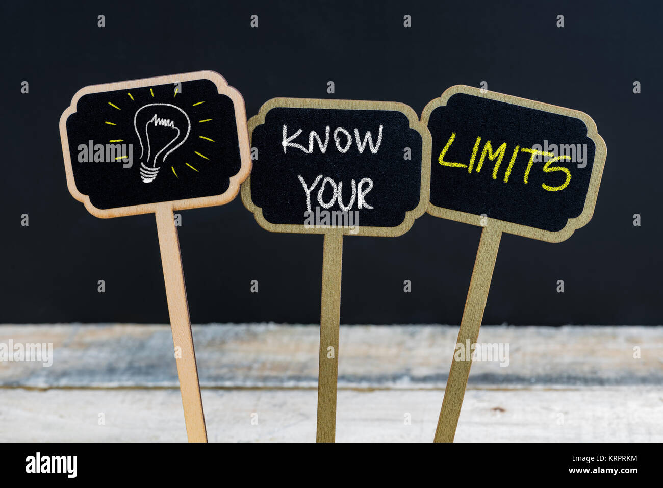Concept message KNOW YOUR LIMITS and light bulb as symbol for idea ...