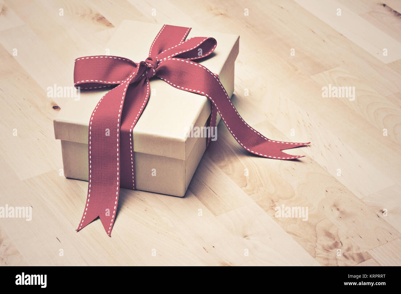 Gift box with red ribbon Stock Photo - Alamy