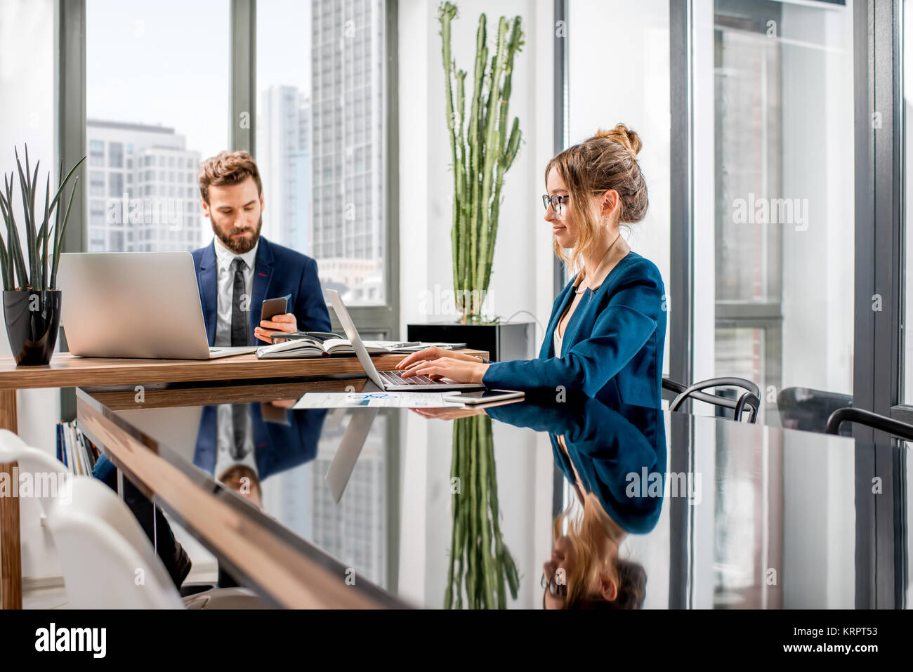 Top managers working at the office Stock Photo - Alamy