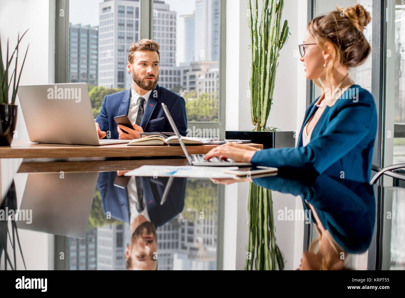 Top managers working at the office Stock Photo - Alamy