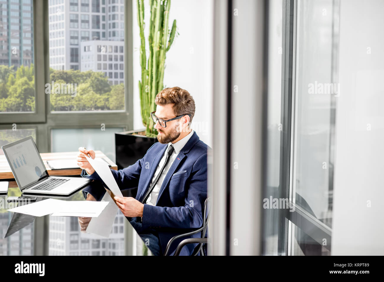 Banker working at the office Stock Photo - Alamy