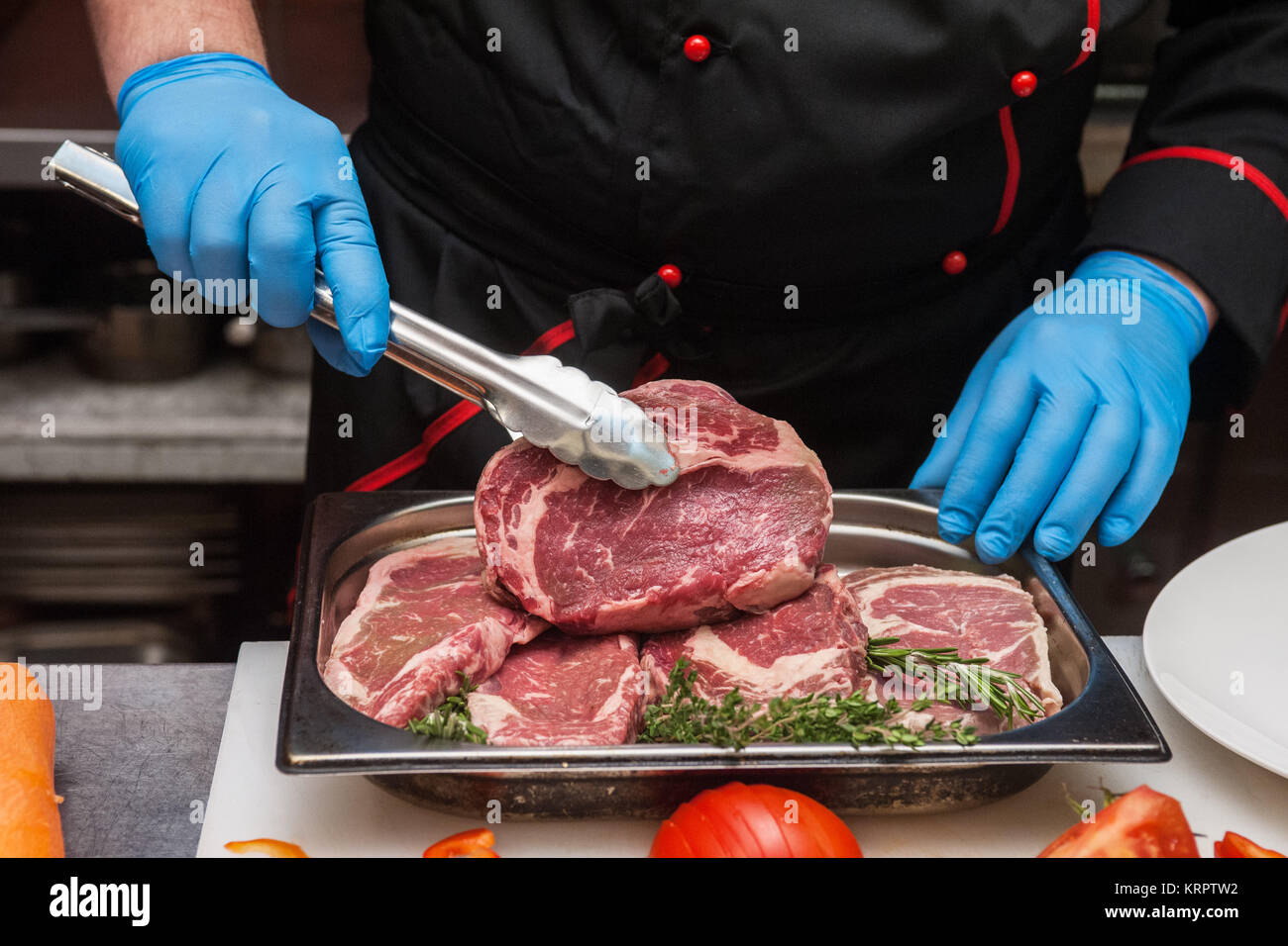 Chef cutting meat Stock Photo - Alamy
