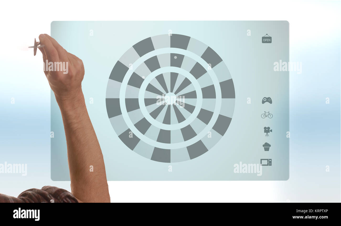 a dart player throws a dart at a computer screen Stock Photo - Alamy