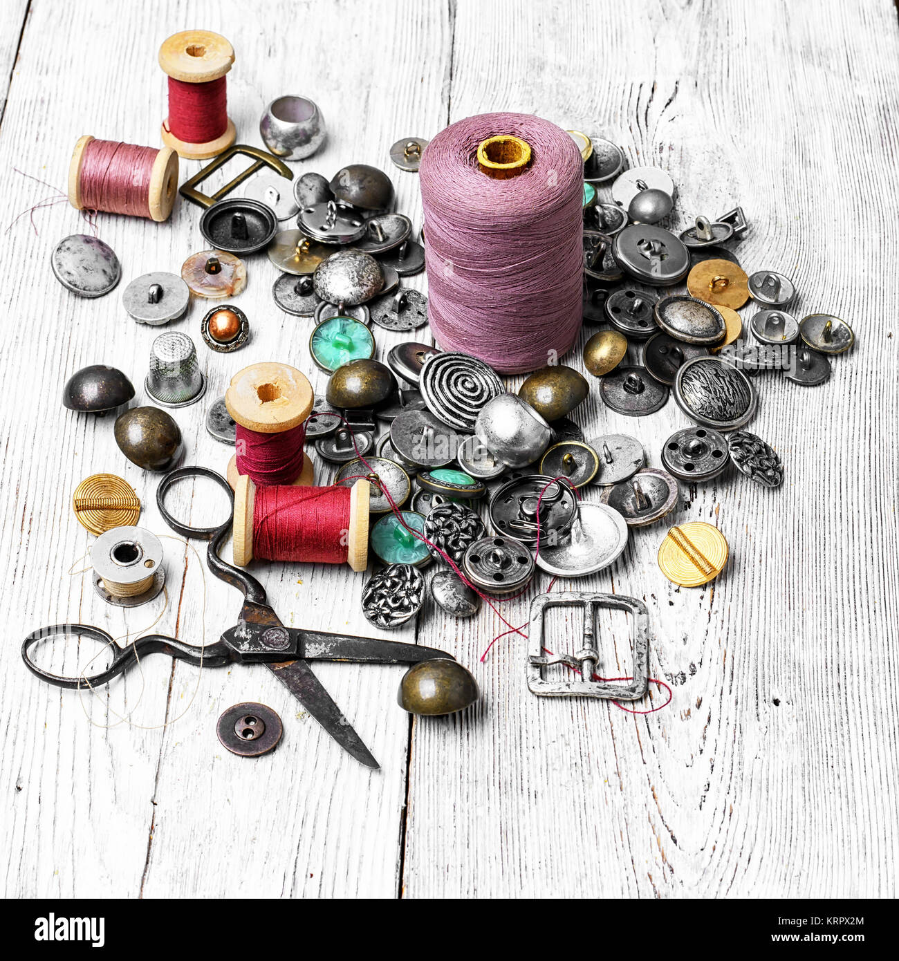 Spools of sewing threads and buttons from clothing Stock Photo - Alamy