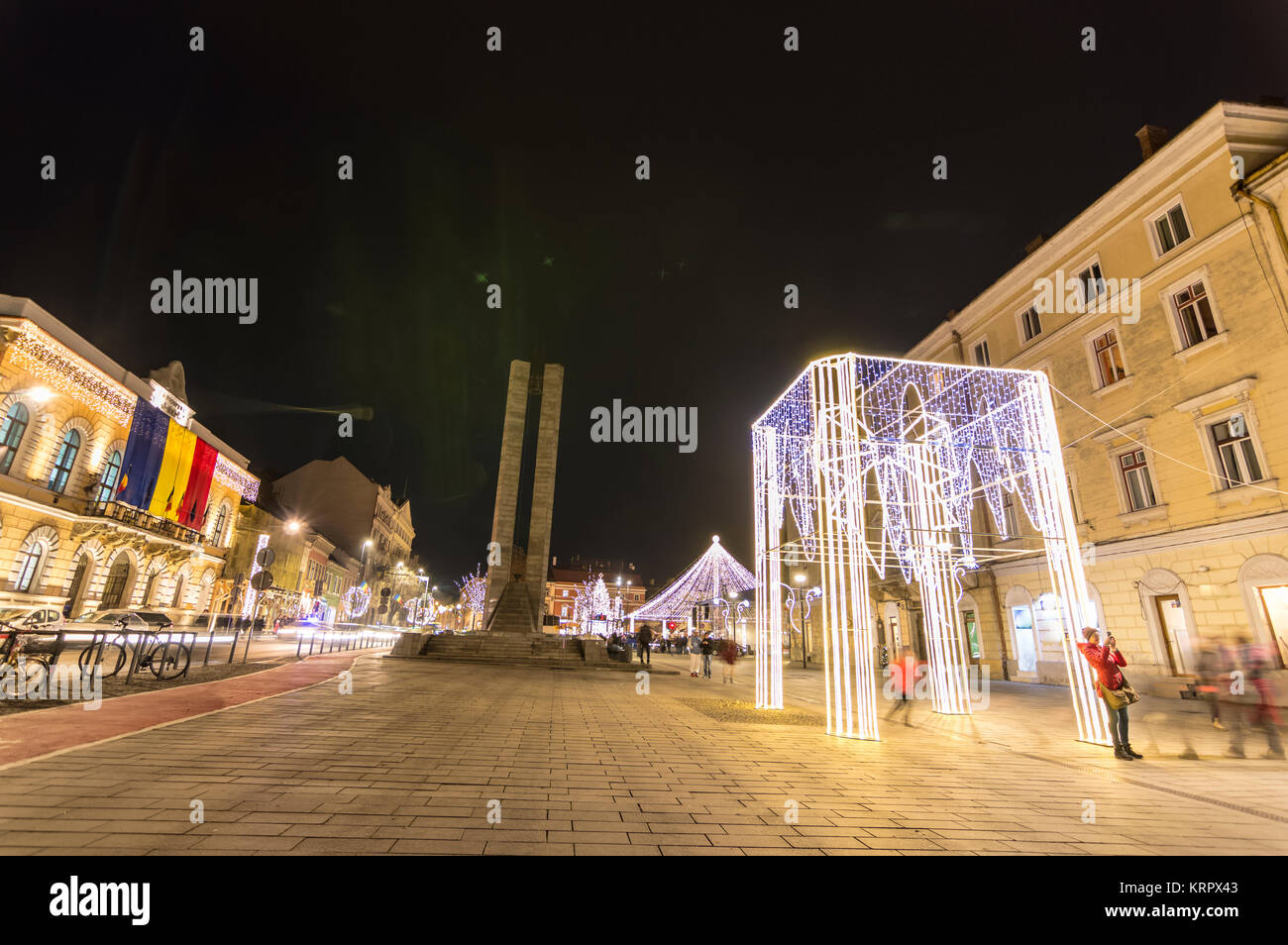 winter night scenery city square with Christmas tree and holiday market ...