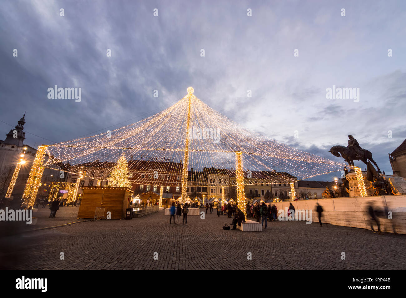 winter night scenery city square with Christmas tree and holiday market ...