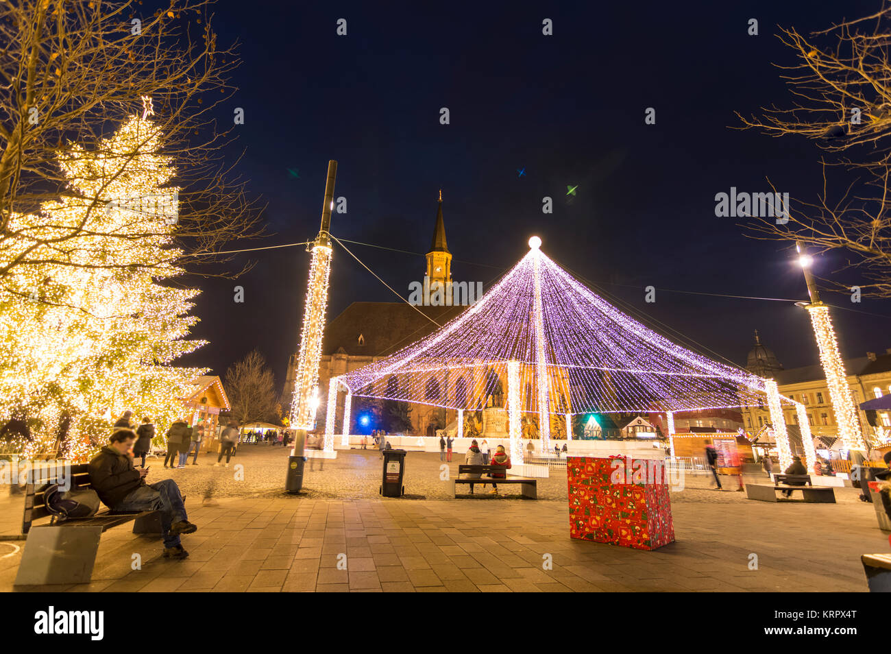 winter night scenery city square with Christmas tree and holiday market ...