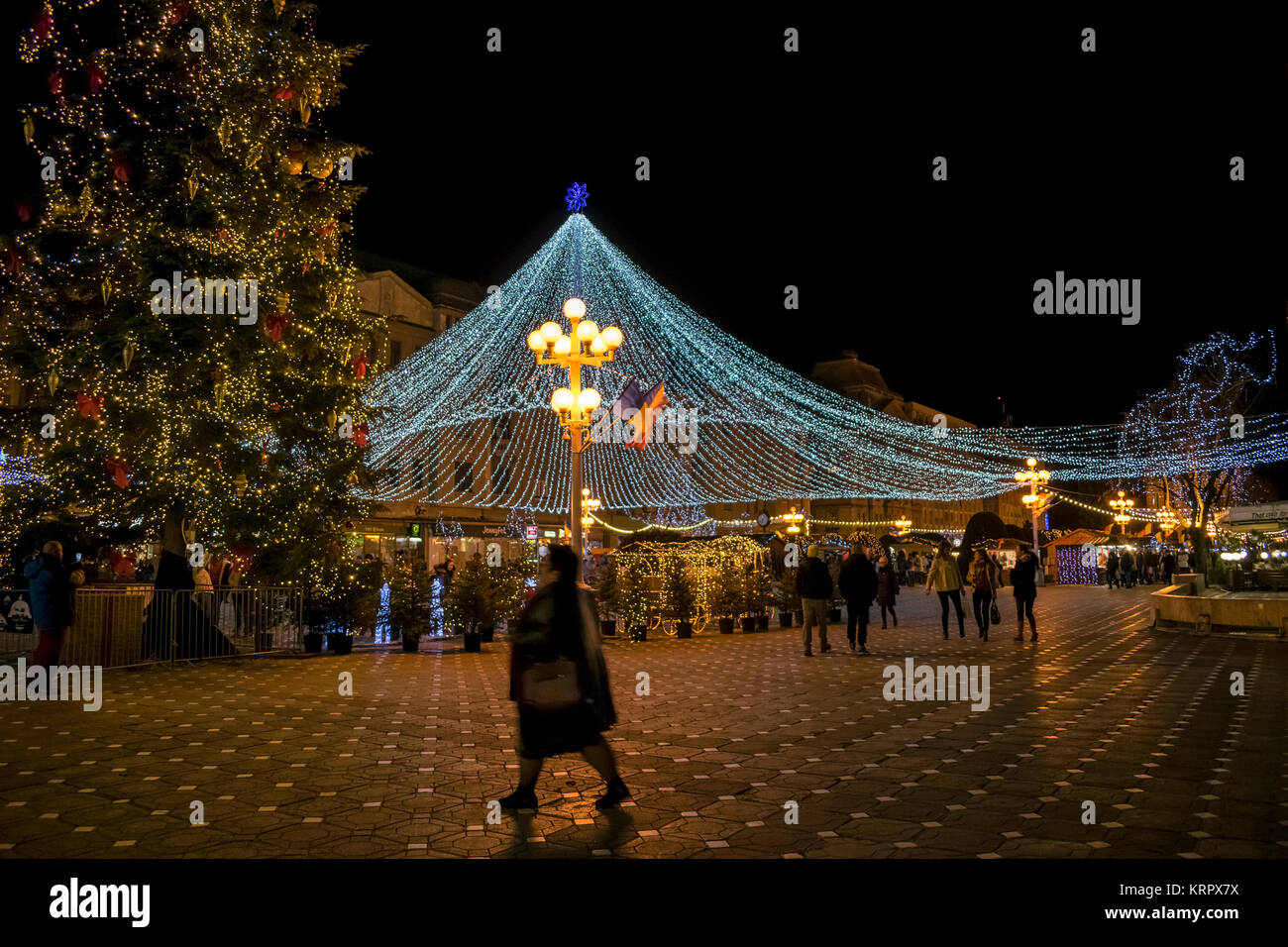 winter night scenery city square with Christmas tree and holiday market ...