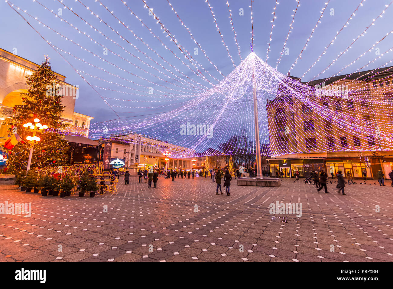 winter night scenery city square with Christmas tree and holiday market ...