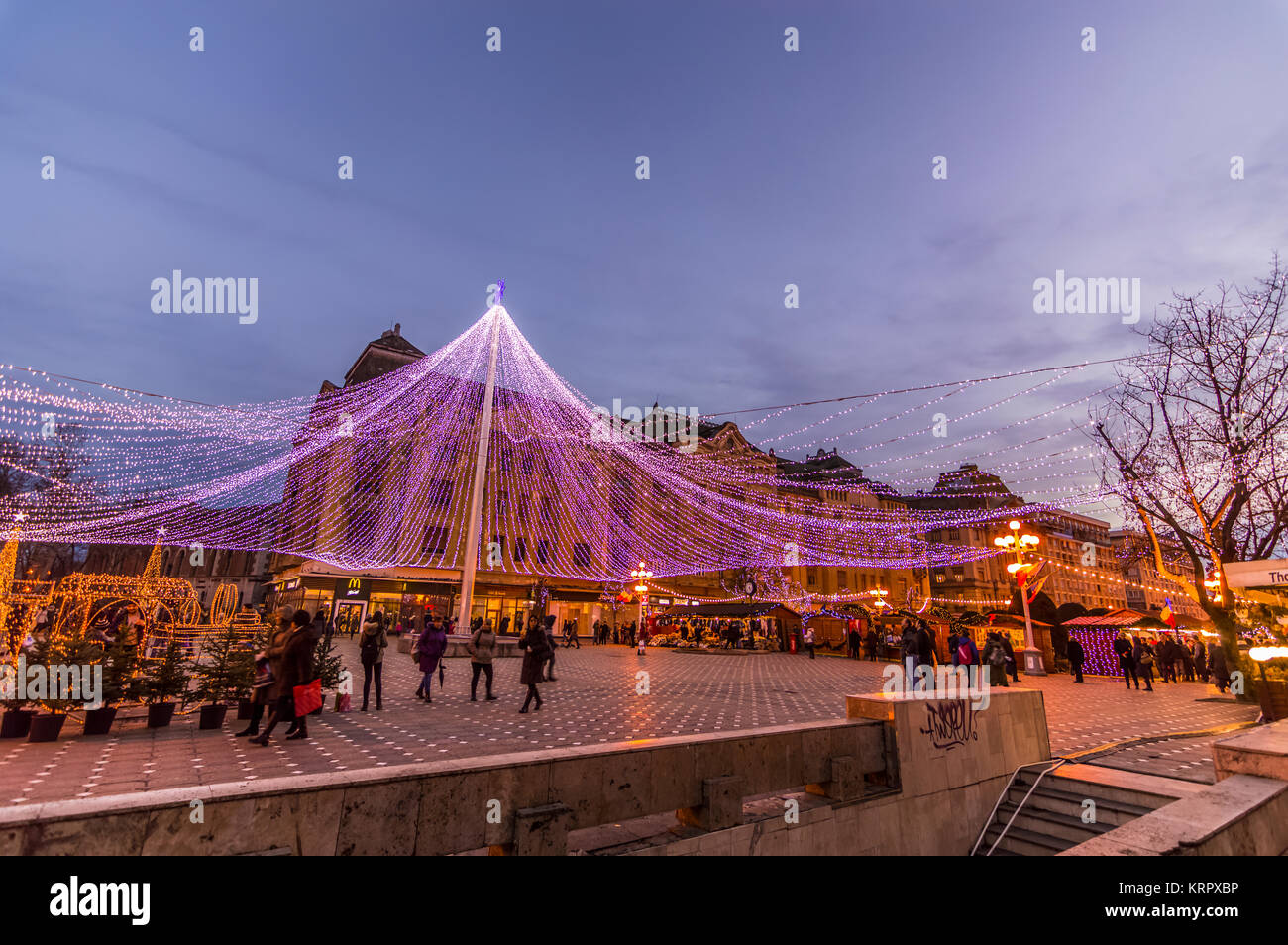 winter night scenery city square with Christmas tree and holiday market ...