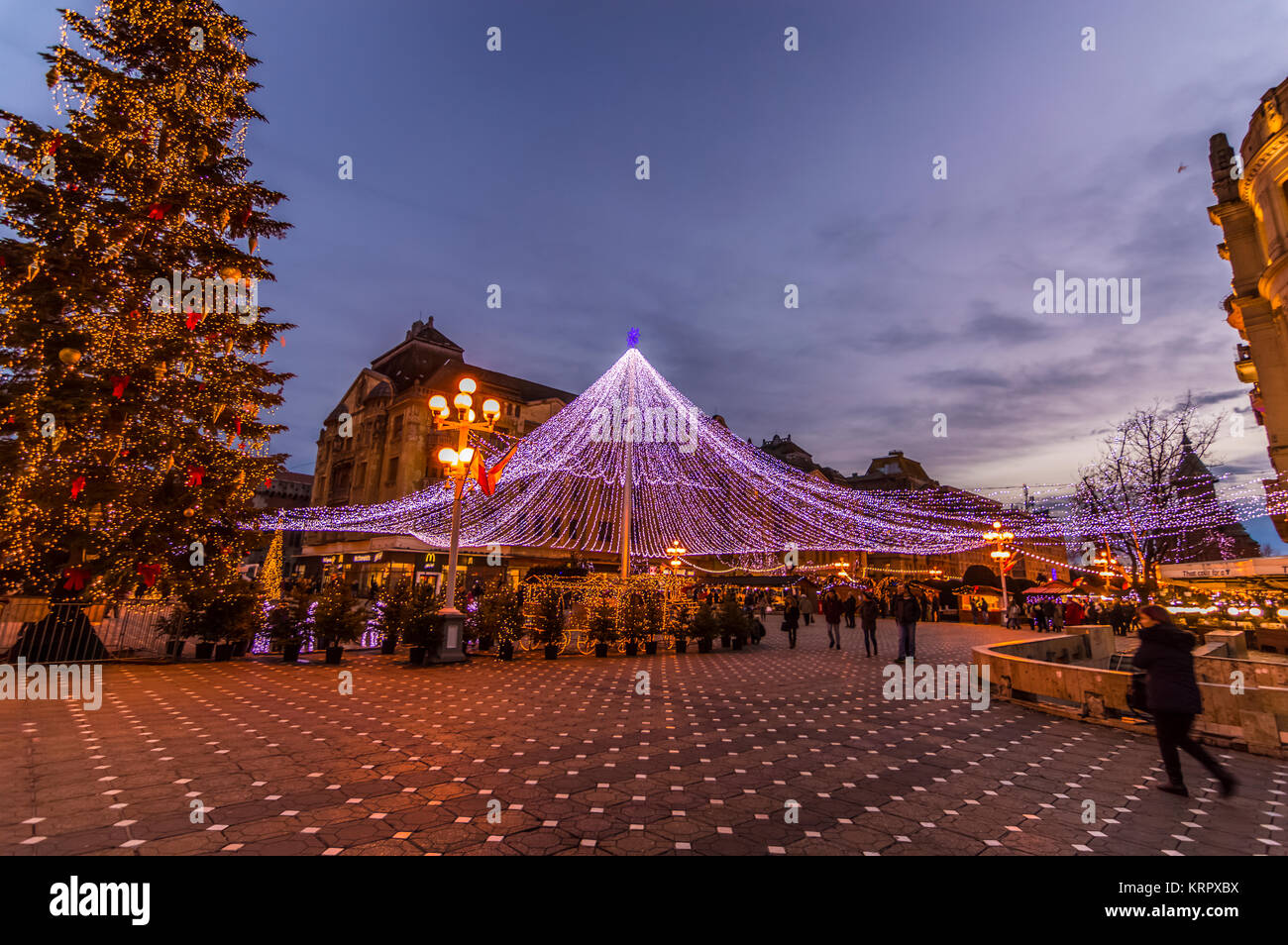 winter night scenery city square with Christmas tree and holiday market ...