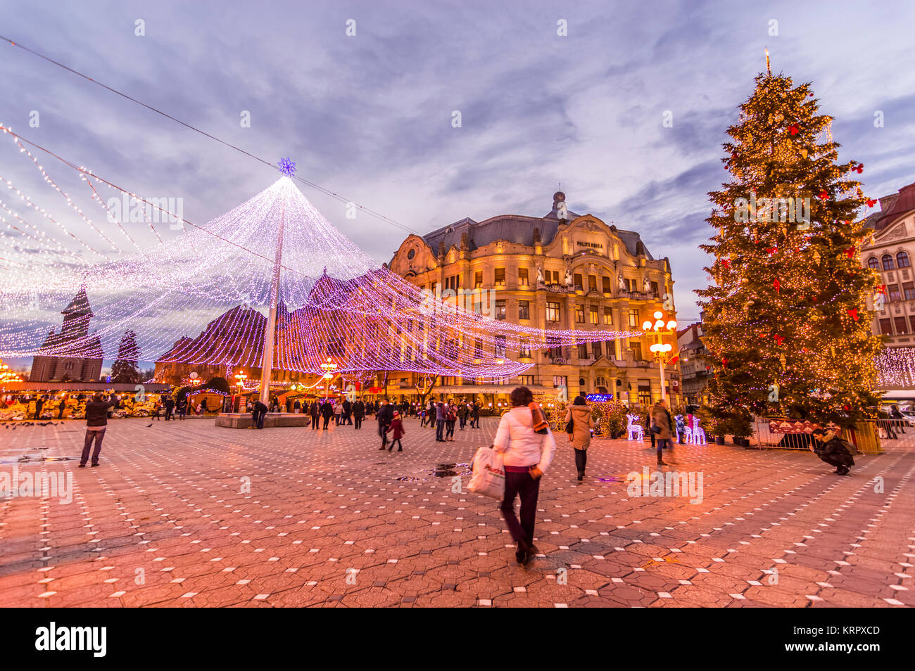 winter night scenery city square with Christmas tree and holiday market ...
