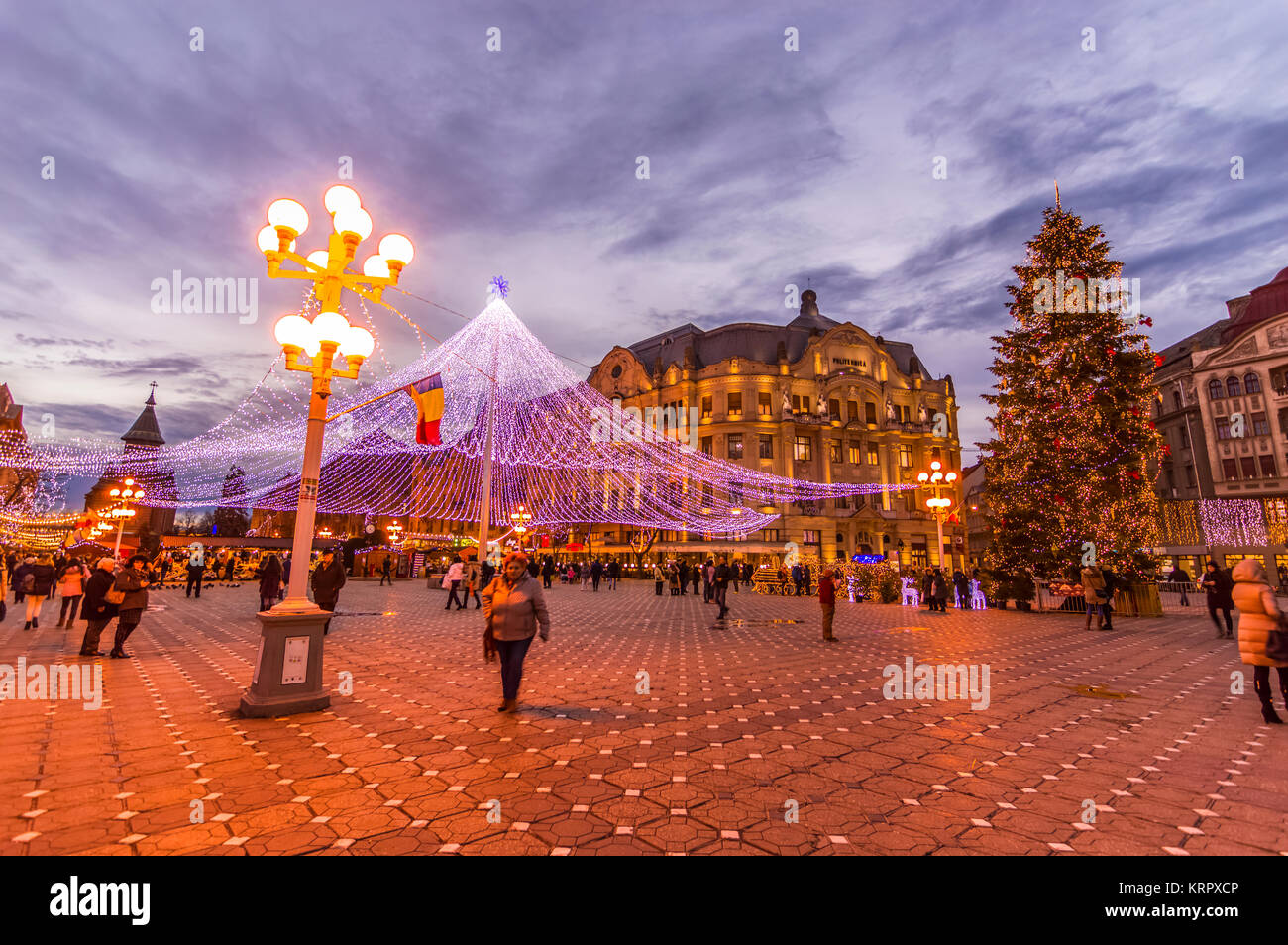 winter night scenery city square with Christmas tree and holiday market ...