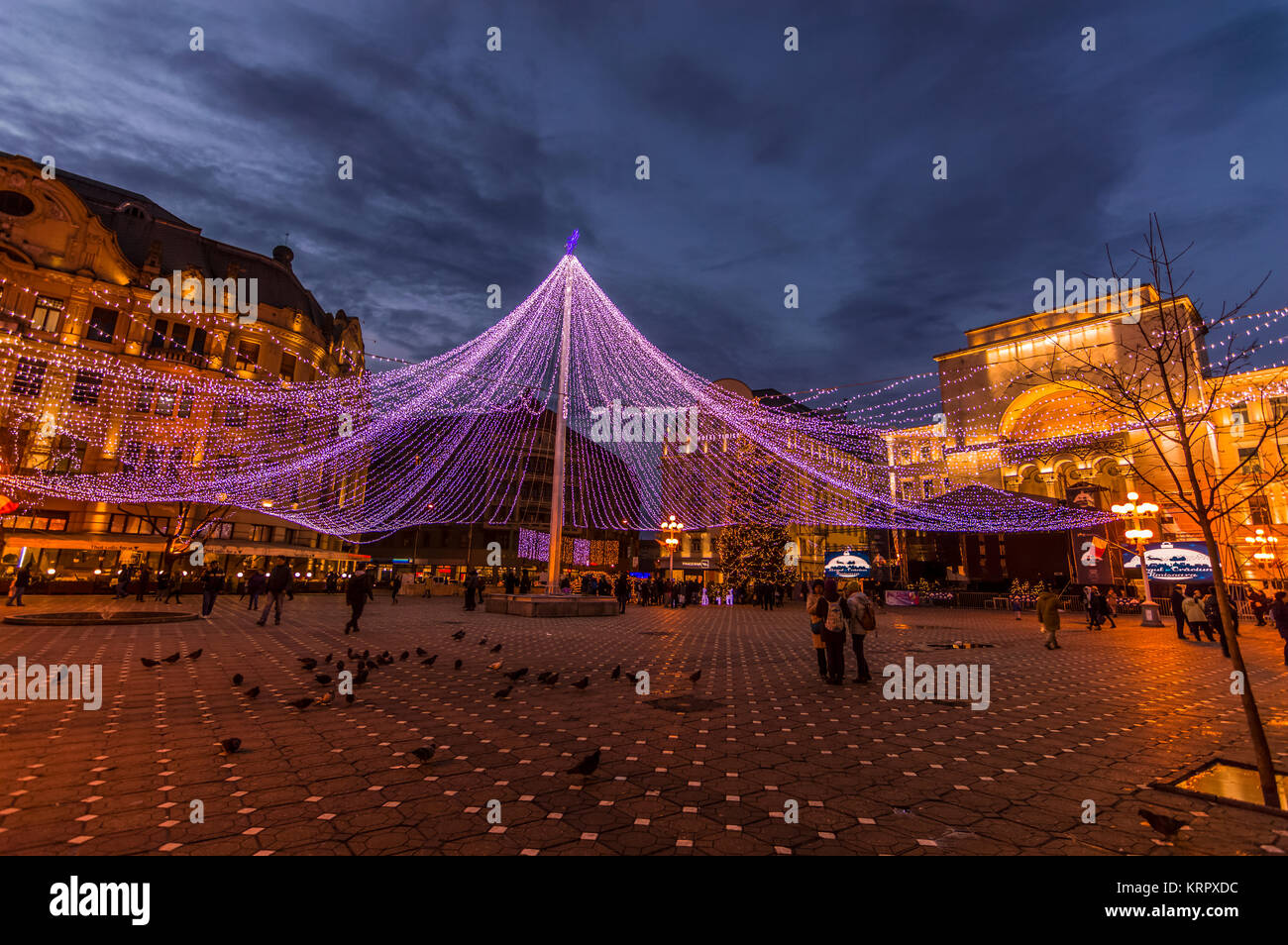 winter night scenery city square with Christmas tree and holiday market ...