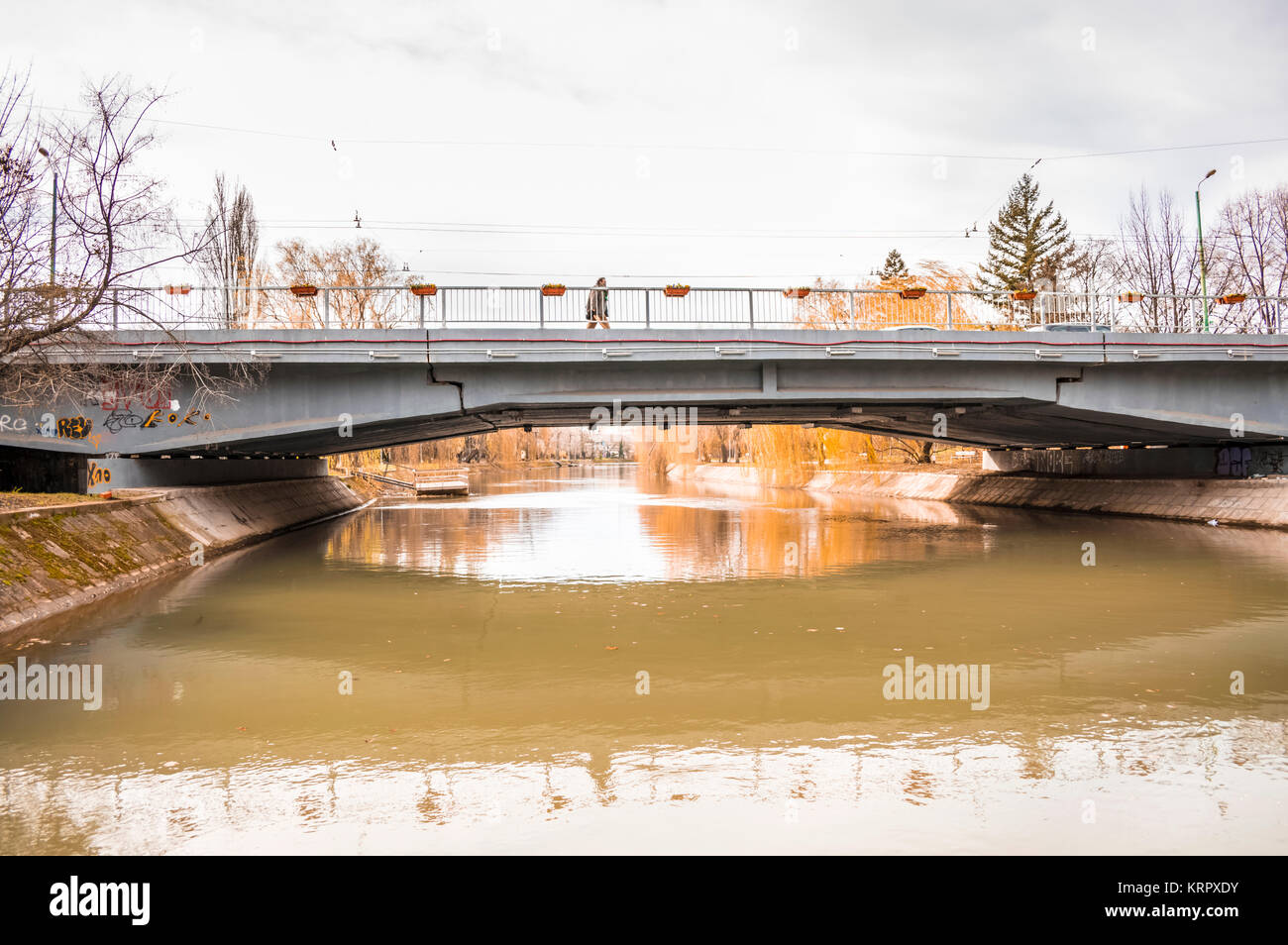 Bega river with arch bridge at sunset. Timisoara city Stock Photo - Alamy