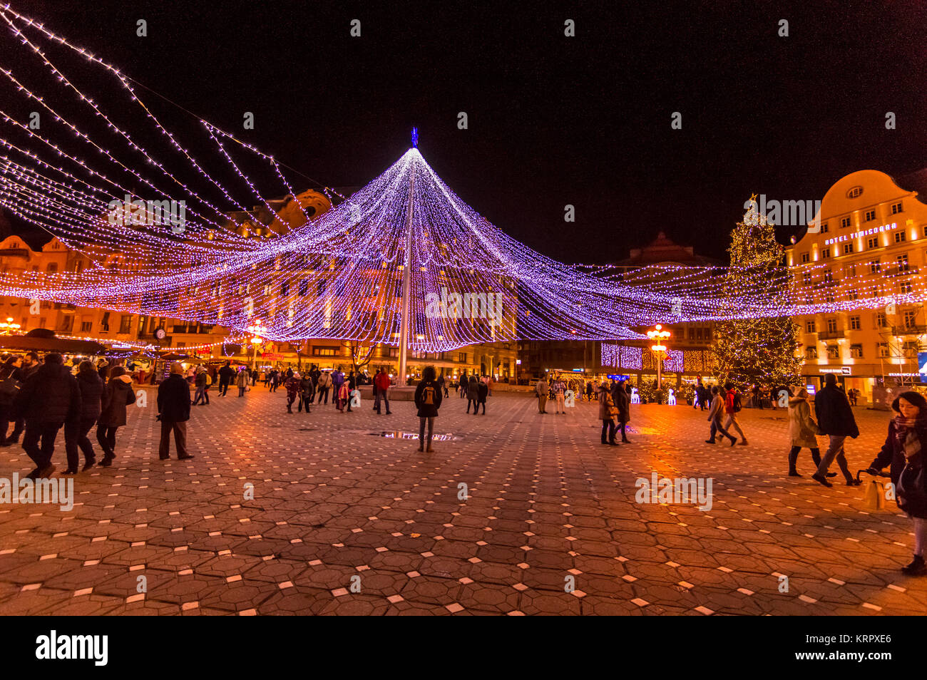 winter night scenery city square with Christmas tree and holiday market ...