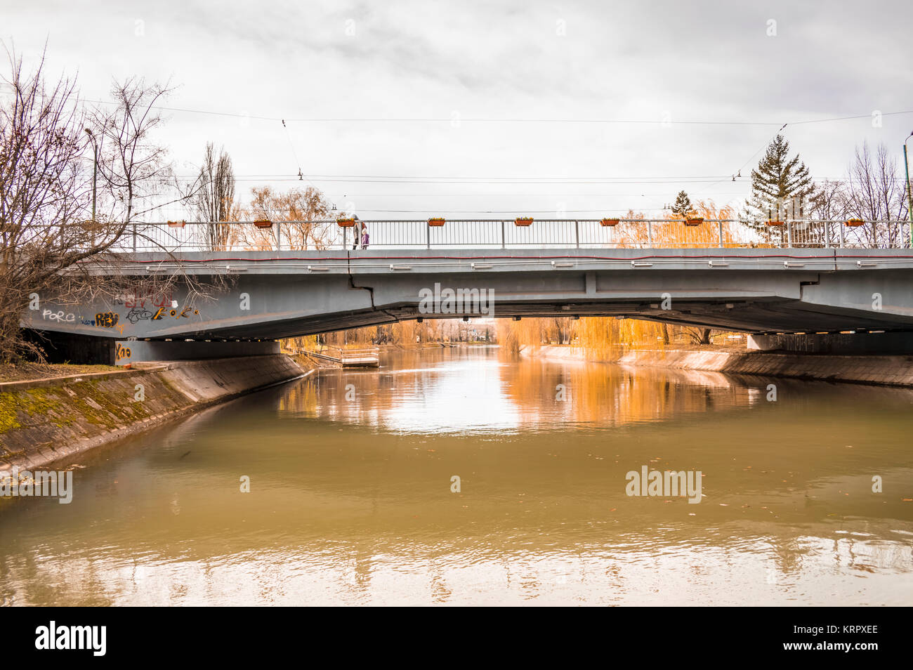 Bega river with arch bridge at sunset. Timisoara city Stock Photo - Alamy