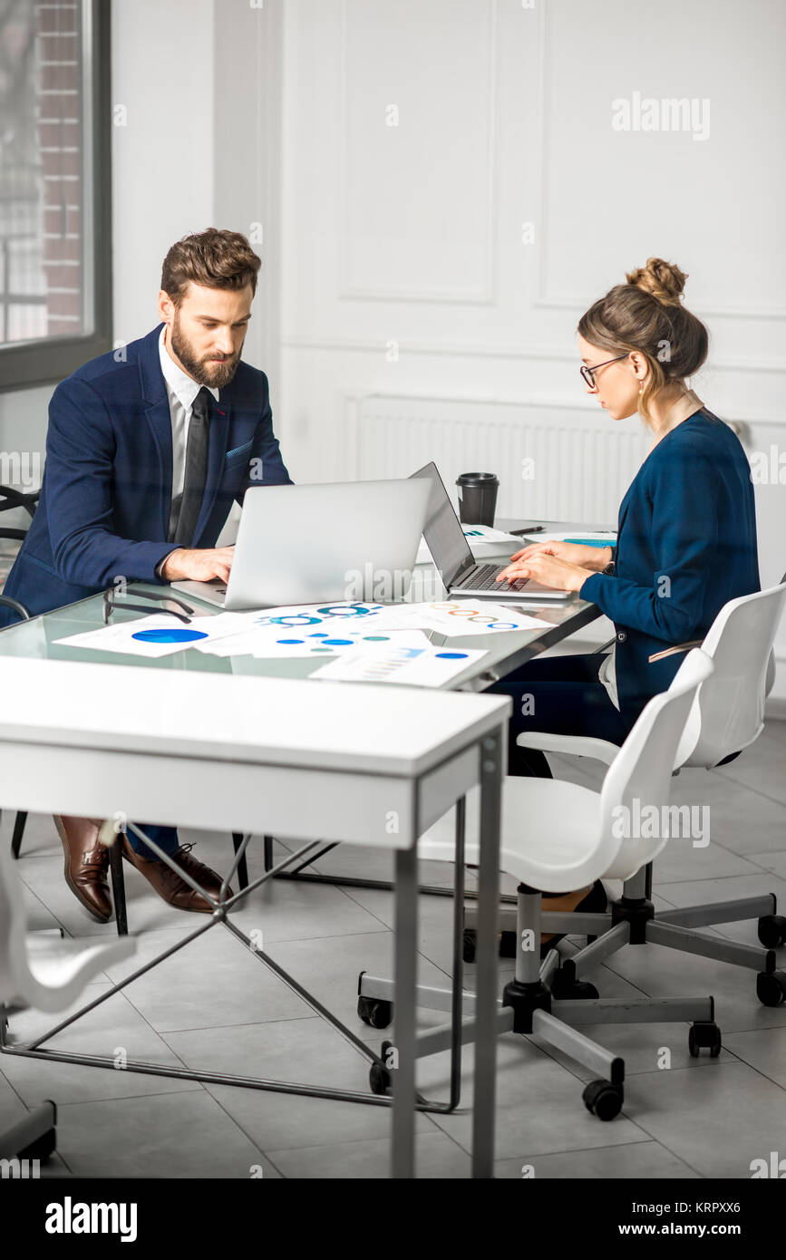 Analytic managers team working at the office Stock Photo - Alamy