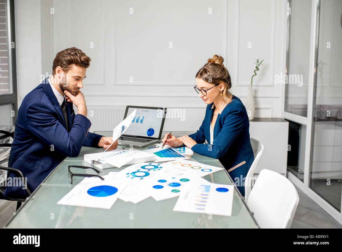 Analytic managers team working at the office Stock Photo - Alamy