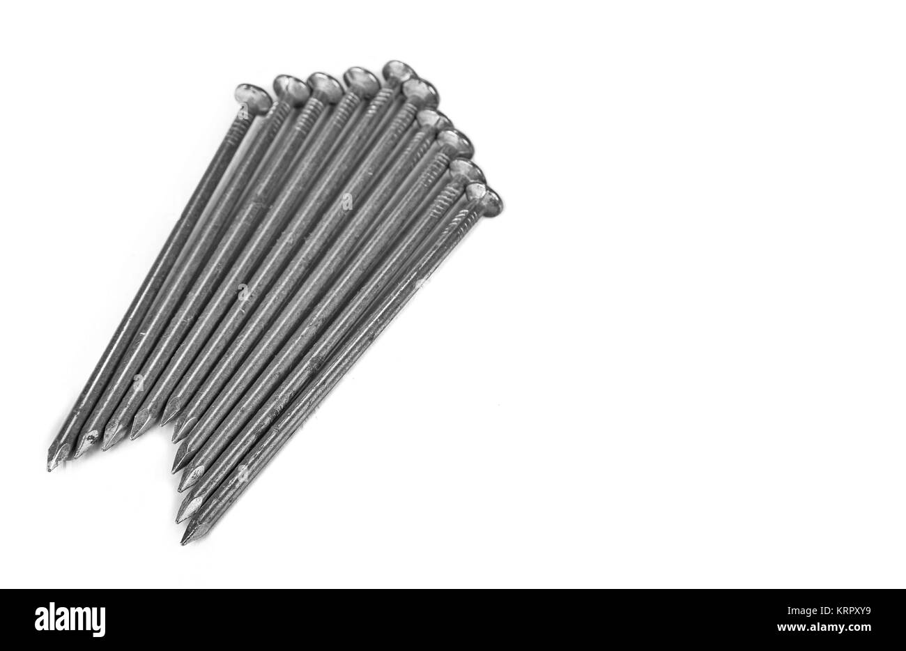Nails for construction on the white background Stock Photo - Alamy
