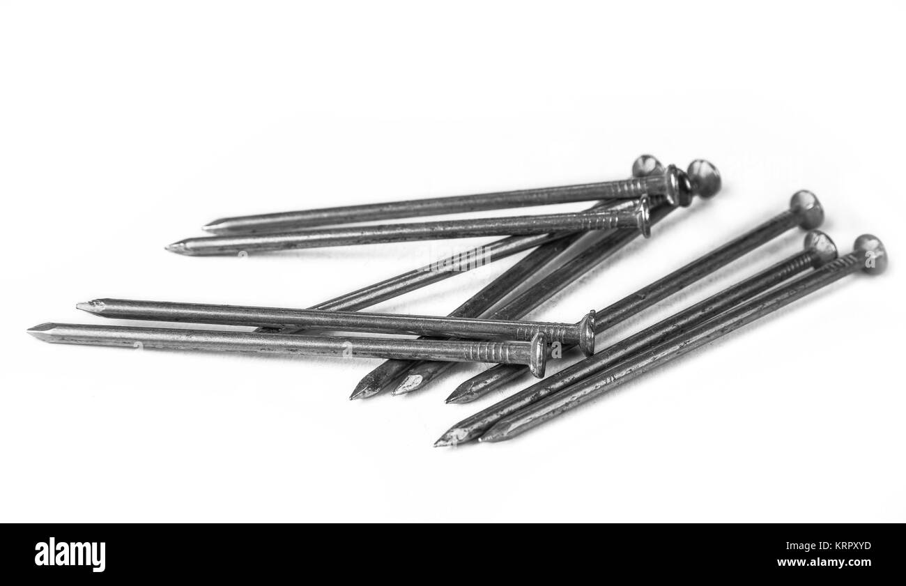 Nails for construction on the white background Stock Photo - Alamy
