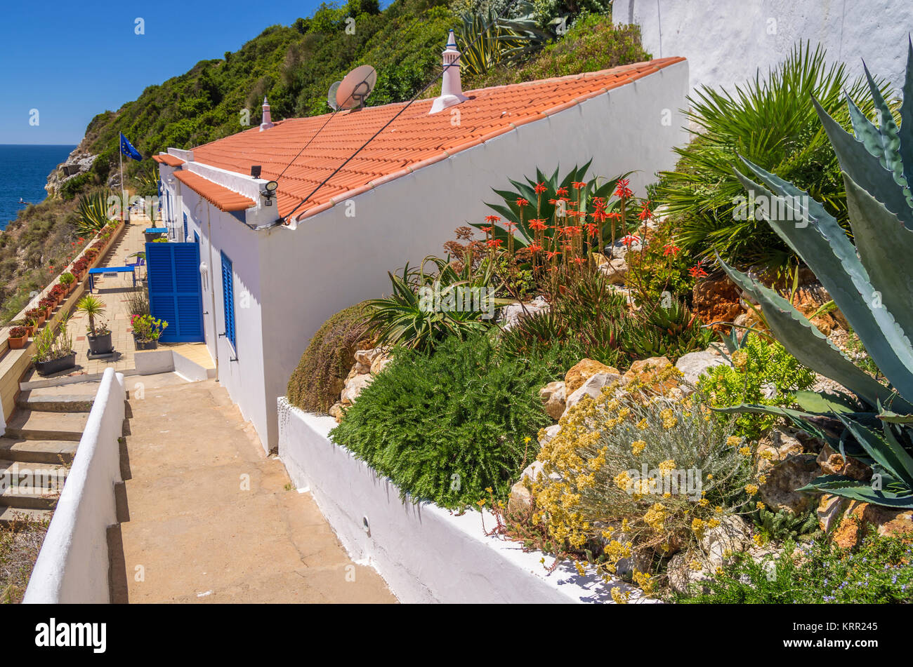 Typical Portugal architecture, with differnt colored windows in Algarve ...