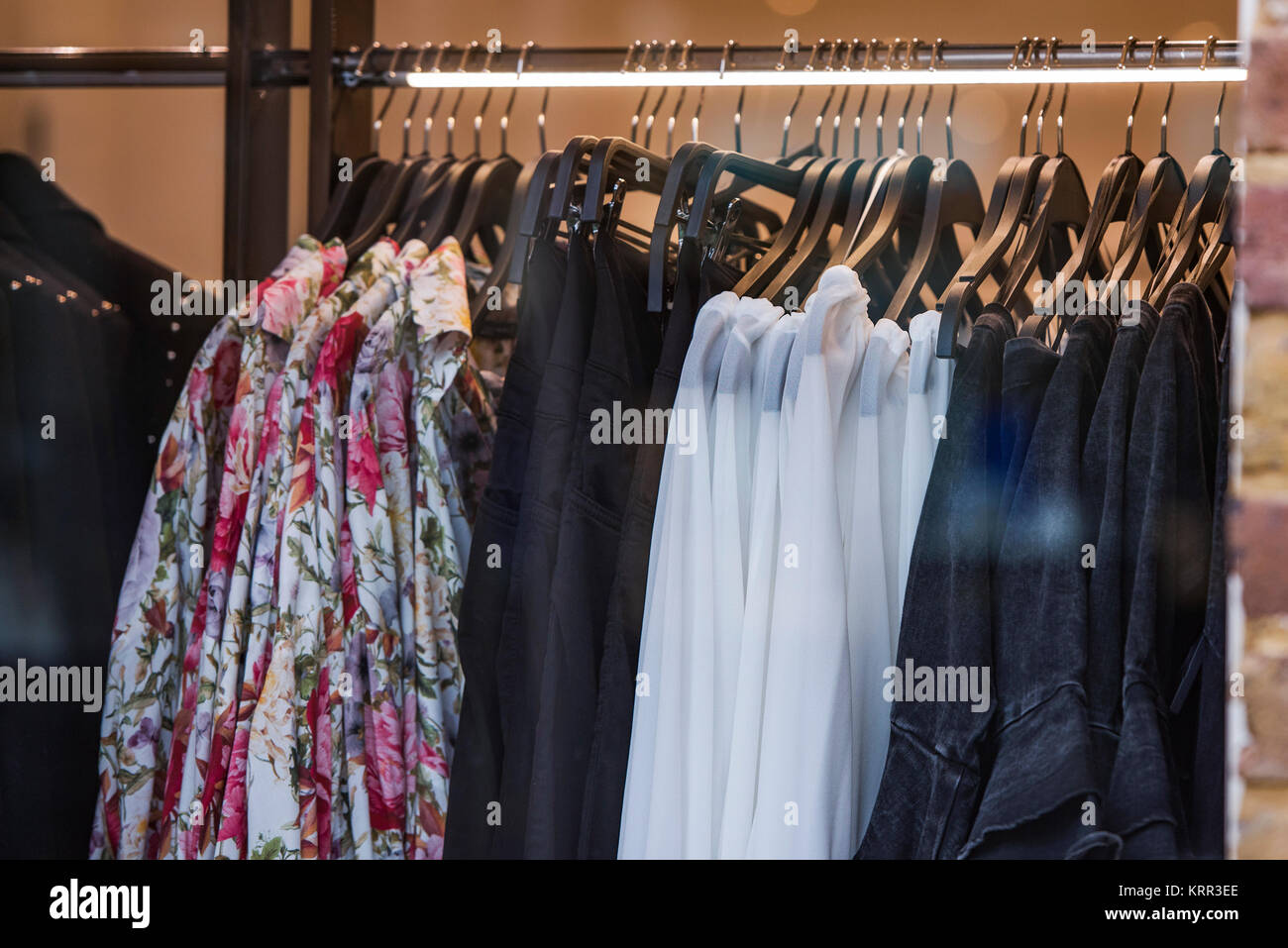 Women clothes on racks in a store in London Stock Photo - Alamy