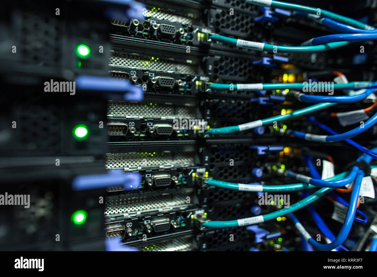 Server rack cluster in a data center (shallow DOF color toned image ...