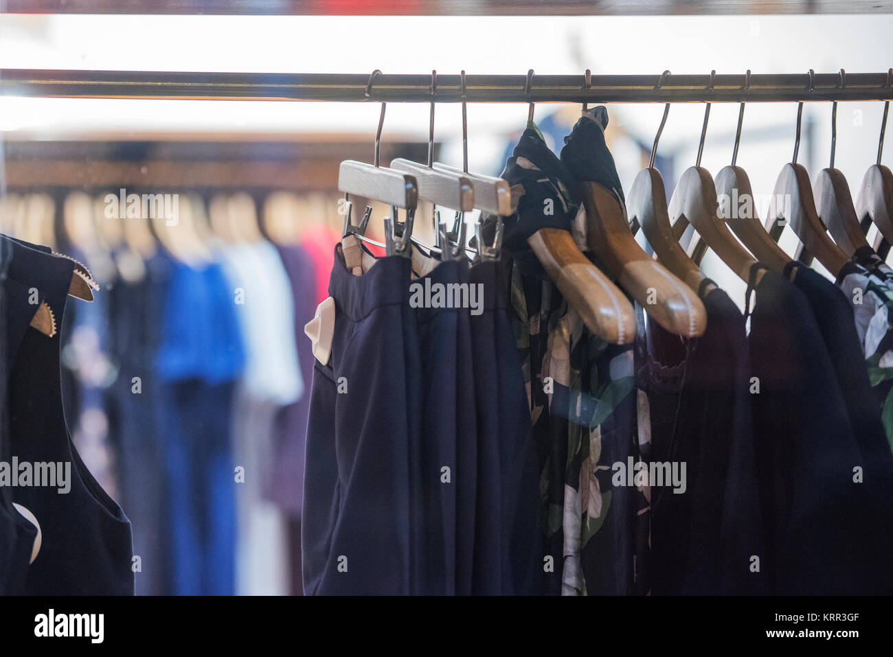 Women clothes on racks in a store in London Stock Photo - Alamy