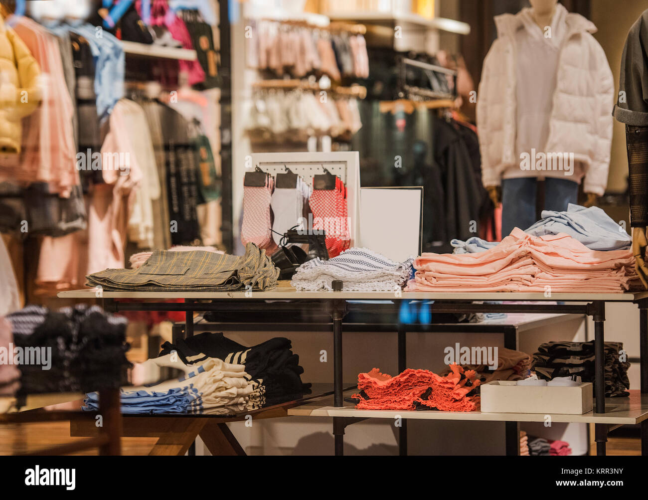 Stacks of clothes in a fashion store Stock Photo - Alamy