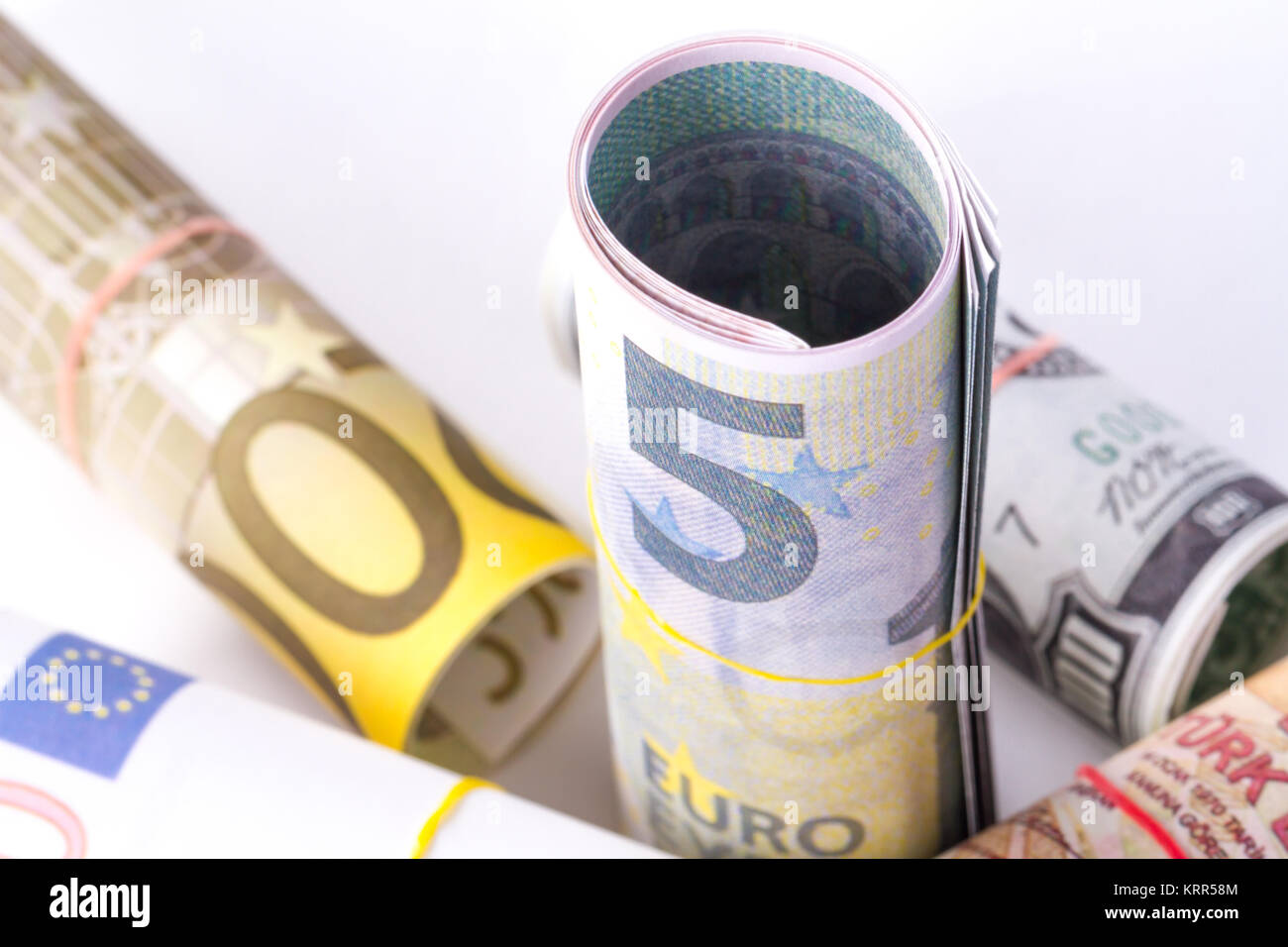 Stack of banknote with money consuming Stock Photo - Alamy