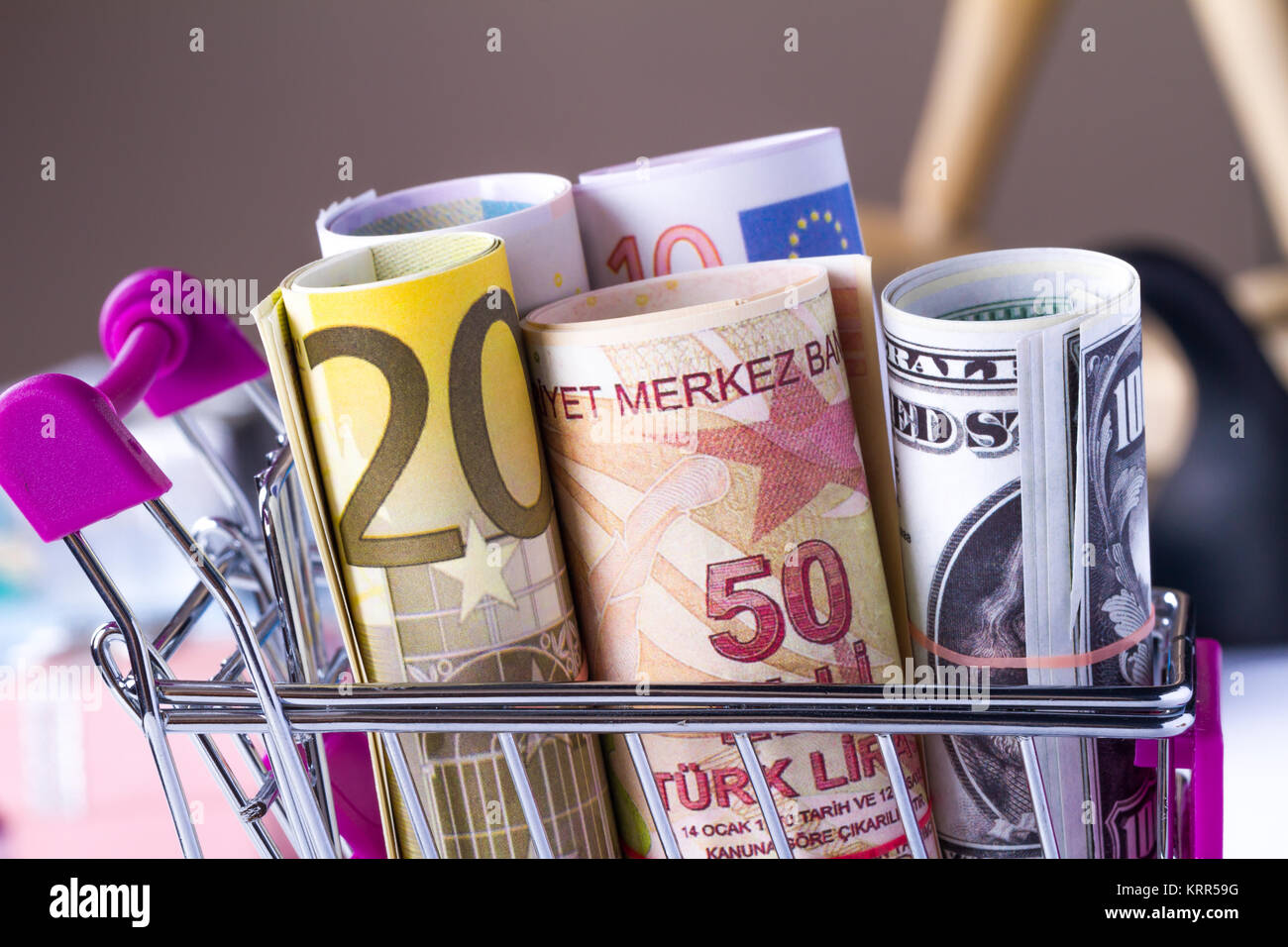 Stack of banknotes in shopping cart with money consuming and finance ...