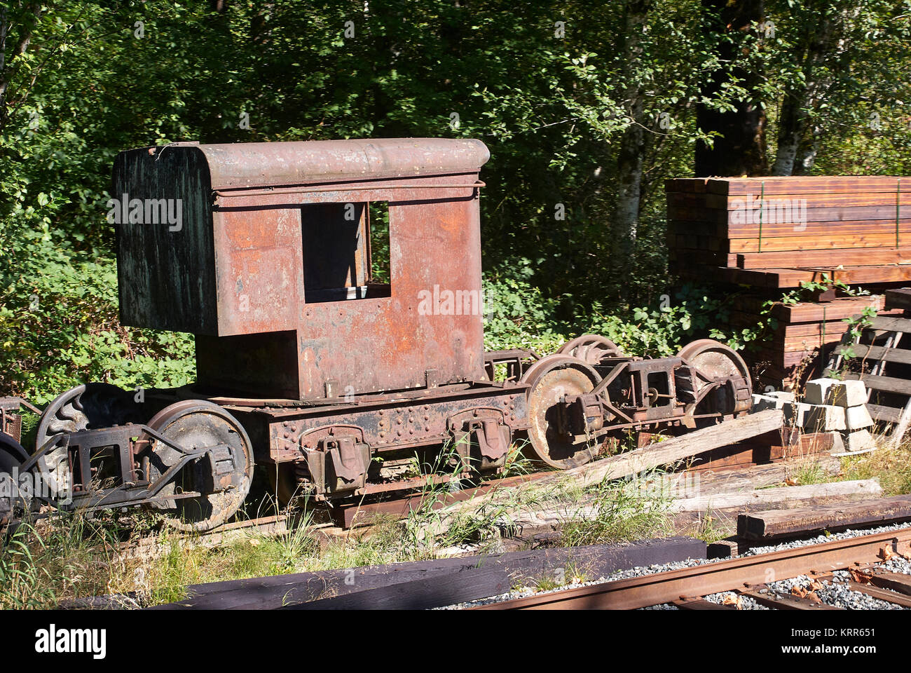 wrecked rail rolling stock rusting in field Stock Photo - Alamy