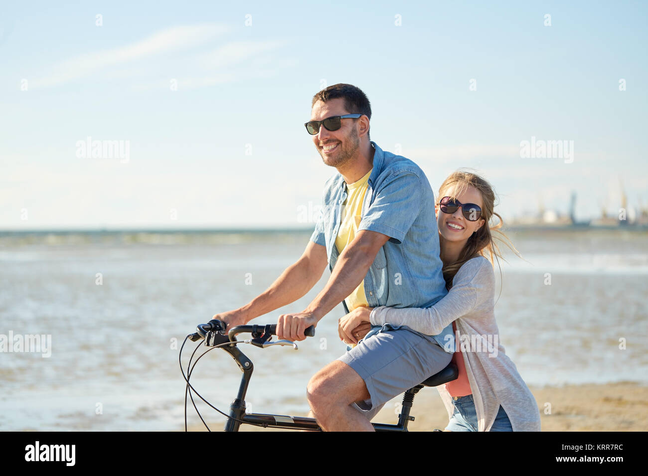 Family on beach riding bicycle hi-res stock photography and images - Alamy