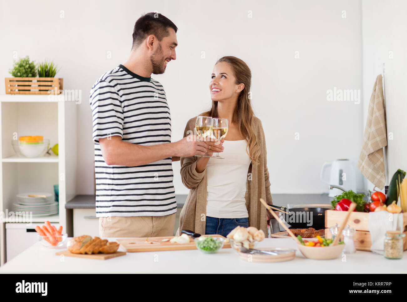 Man cooking woman drink wine hi-res stock photography and images - Alamy