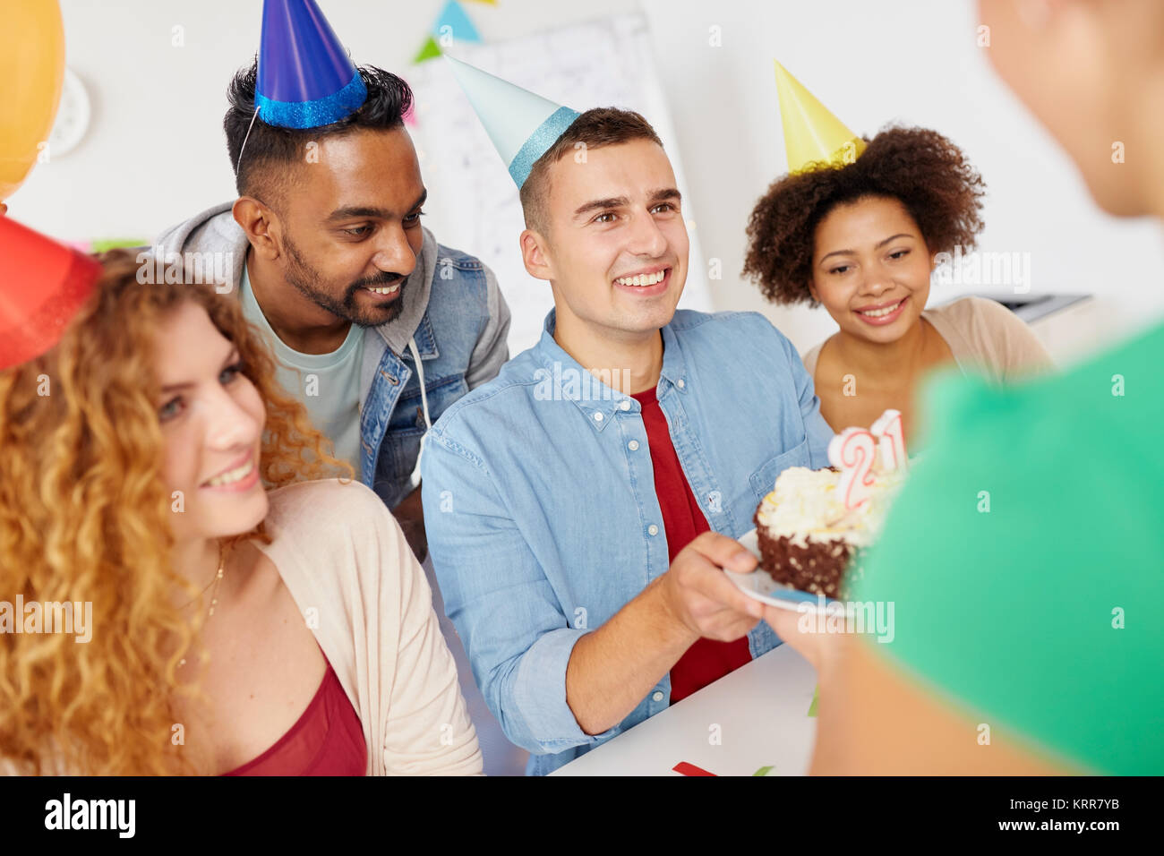 team greeting colleague at office birthday party Stock Photo - Alamy