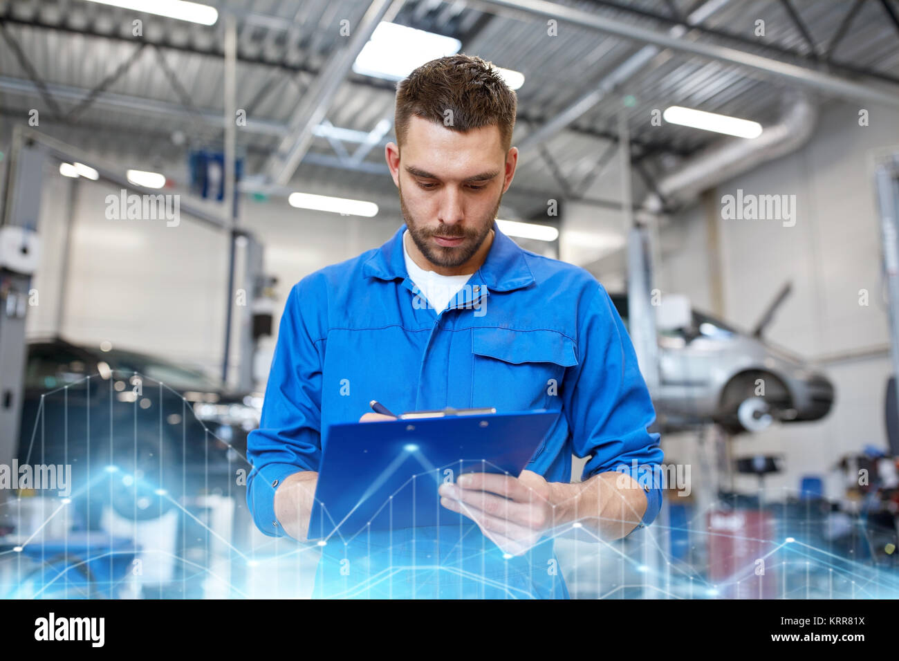 auto mechanic man with clipboard at car workshop Stock Photo - Alamy