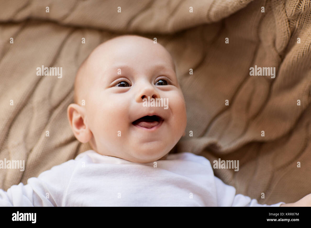 sweet little baby boy lying on knitted blanket Stock Photo - Alamy