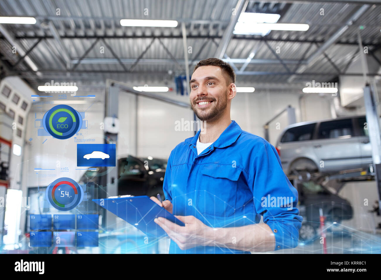 happy mechanic man with clipboard at car workshop Stock Photo - Alamy