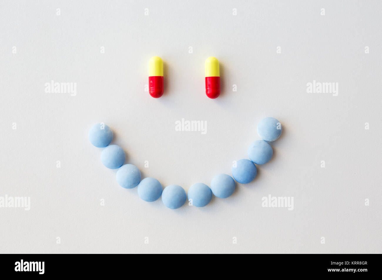 smiley of different pills and capsules of drugs Stock Photo - Alamy