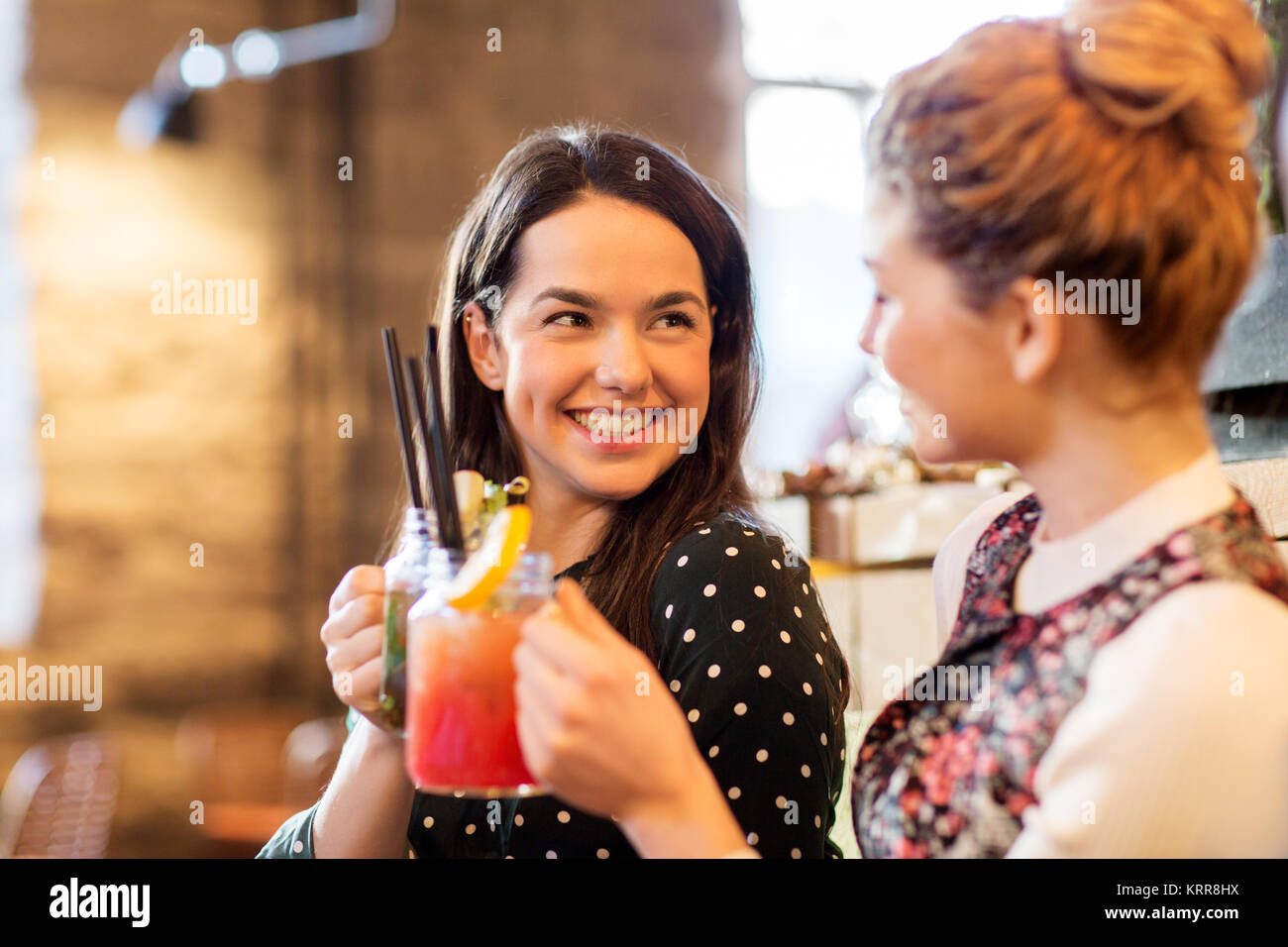 happy friends clinking drinks at restaurant Stock Photo - Alamy