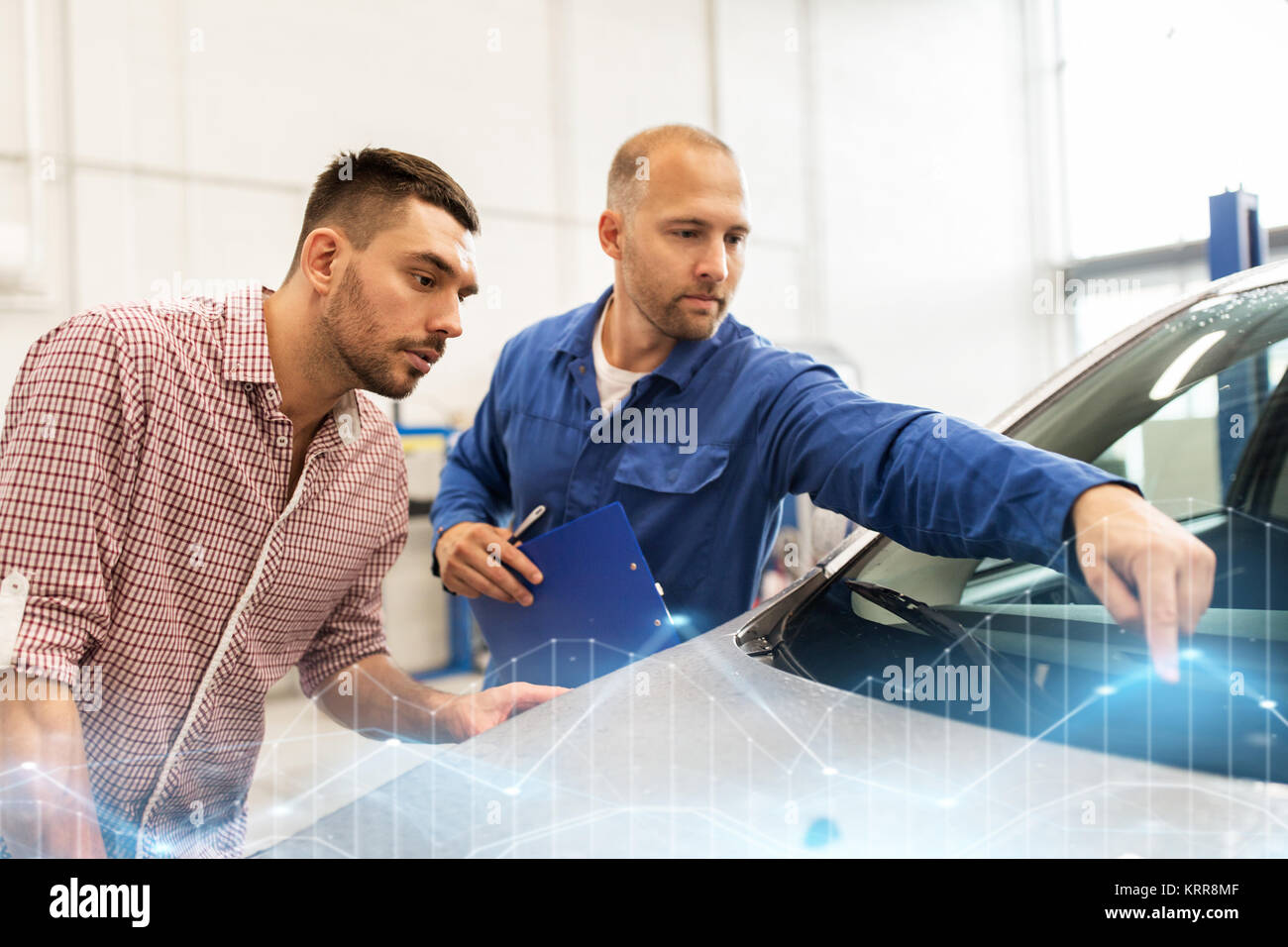 auto mechanic with clipboard and man at car shop Stock Photo - Alamy