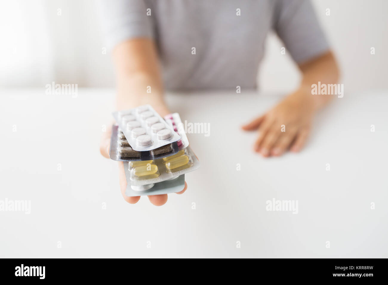 woman hands holding packs of pills Stock Photo - Alamy
